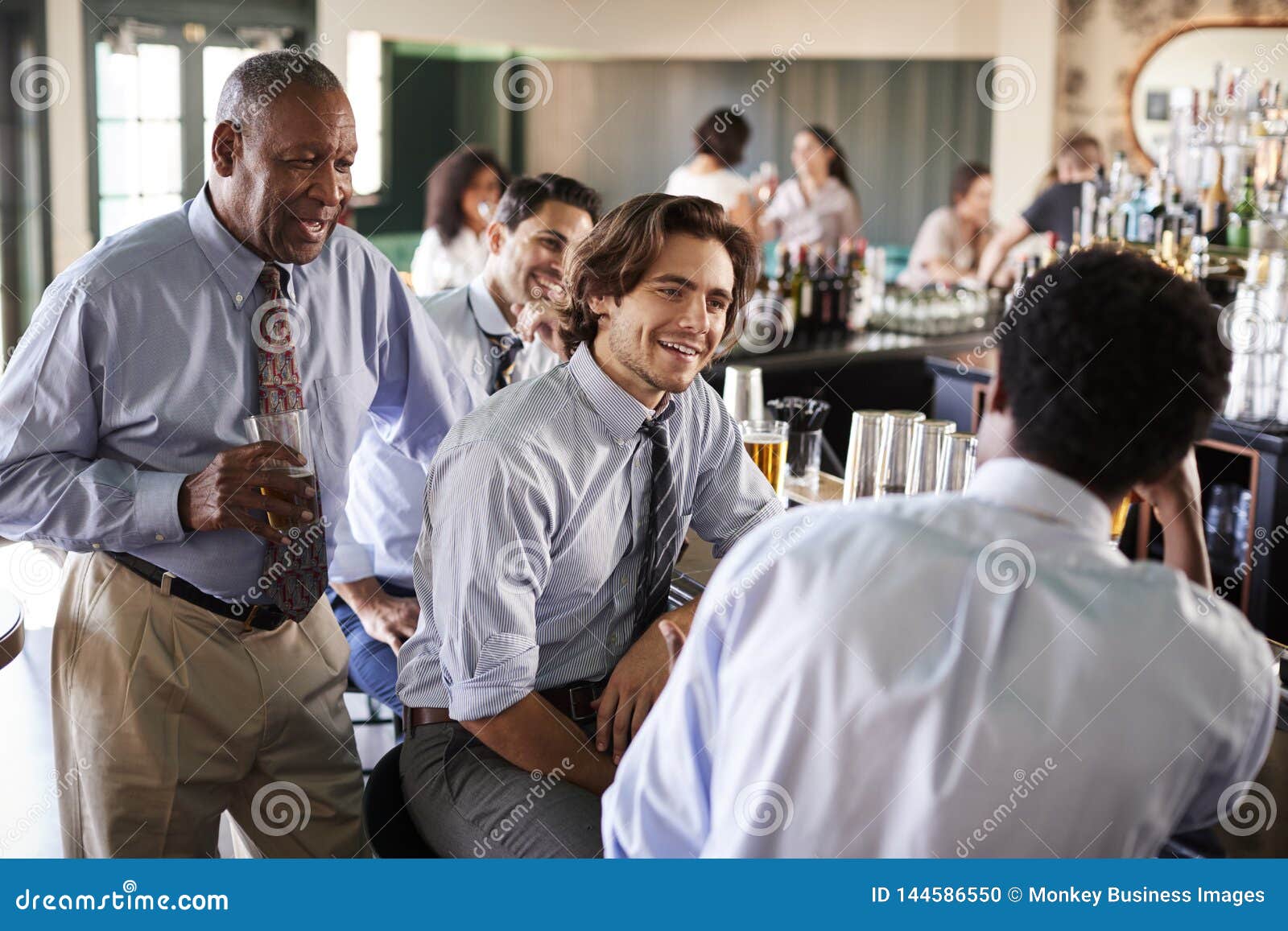 Group of Businessmen Meeting for after Works Drinks in Bar Stock Photo ...