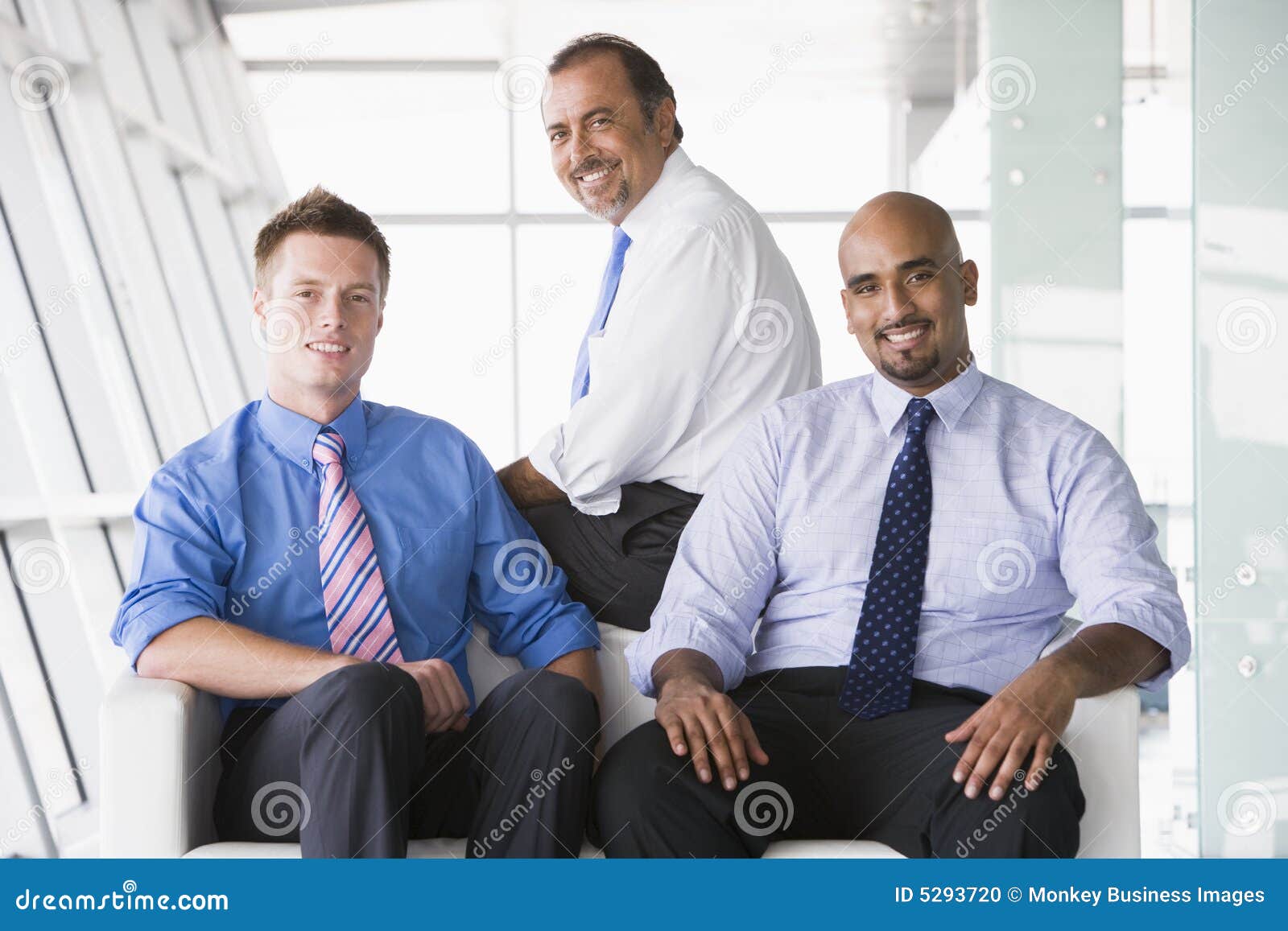 Group of Businessmen Sitting in Lobby Stock Photo - Image of building ...
