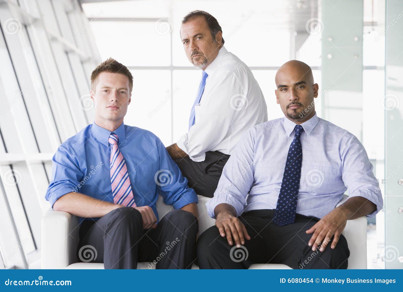 Group of Businessmen Sitting in Lobby Stock Photo - Image of expression ...
