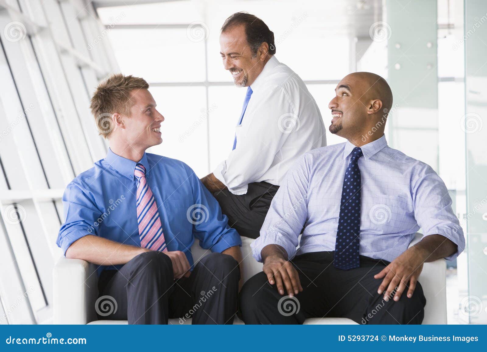 Group of Businessmen Talking in Lobby Stock Photo - Image of commerce ...