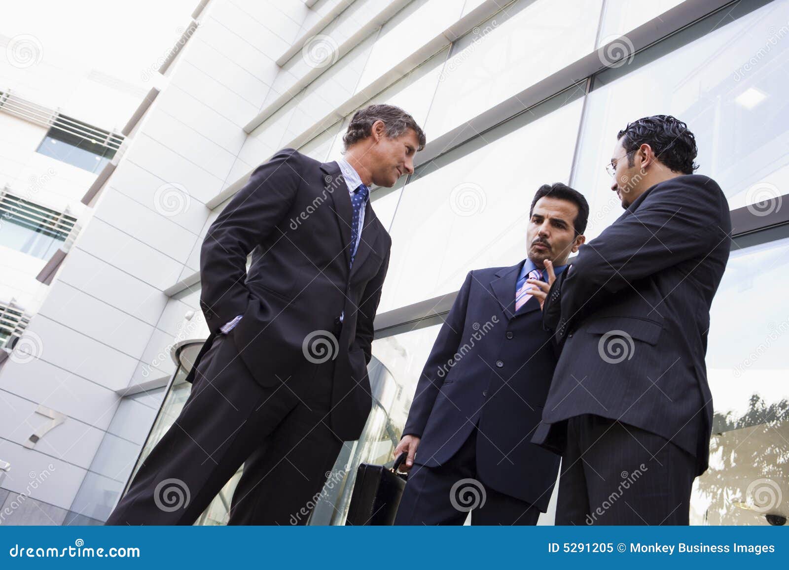 Group of Businessmen Talking Outside Office Stock Image - Image of ...