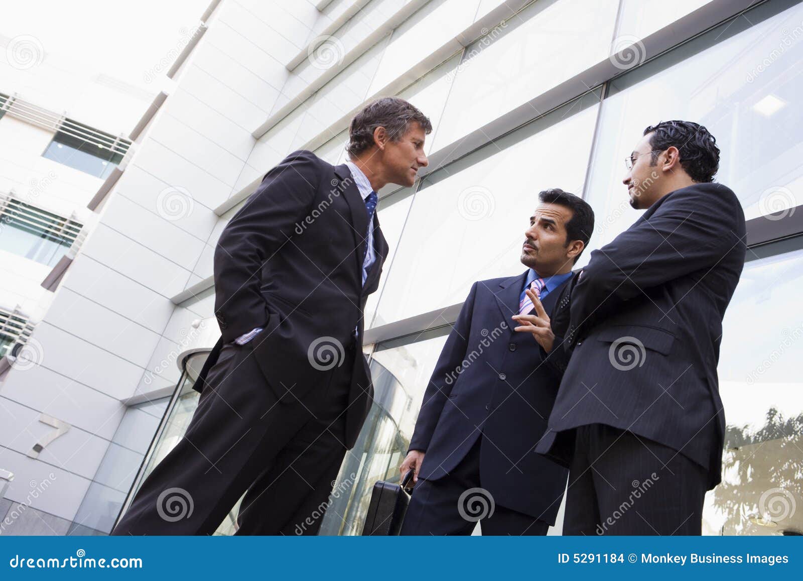 Businessmen Talking About Work Project On Background Modern Office ...