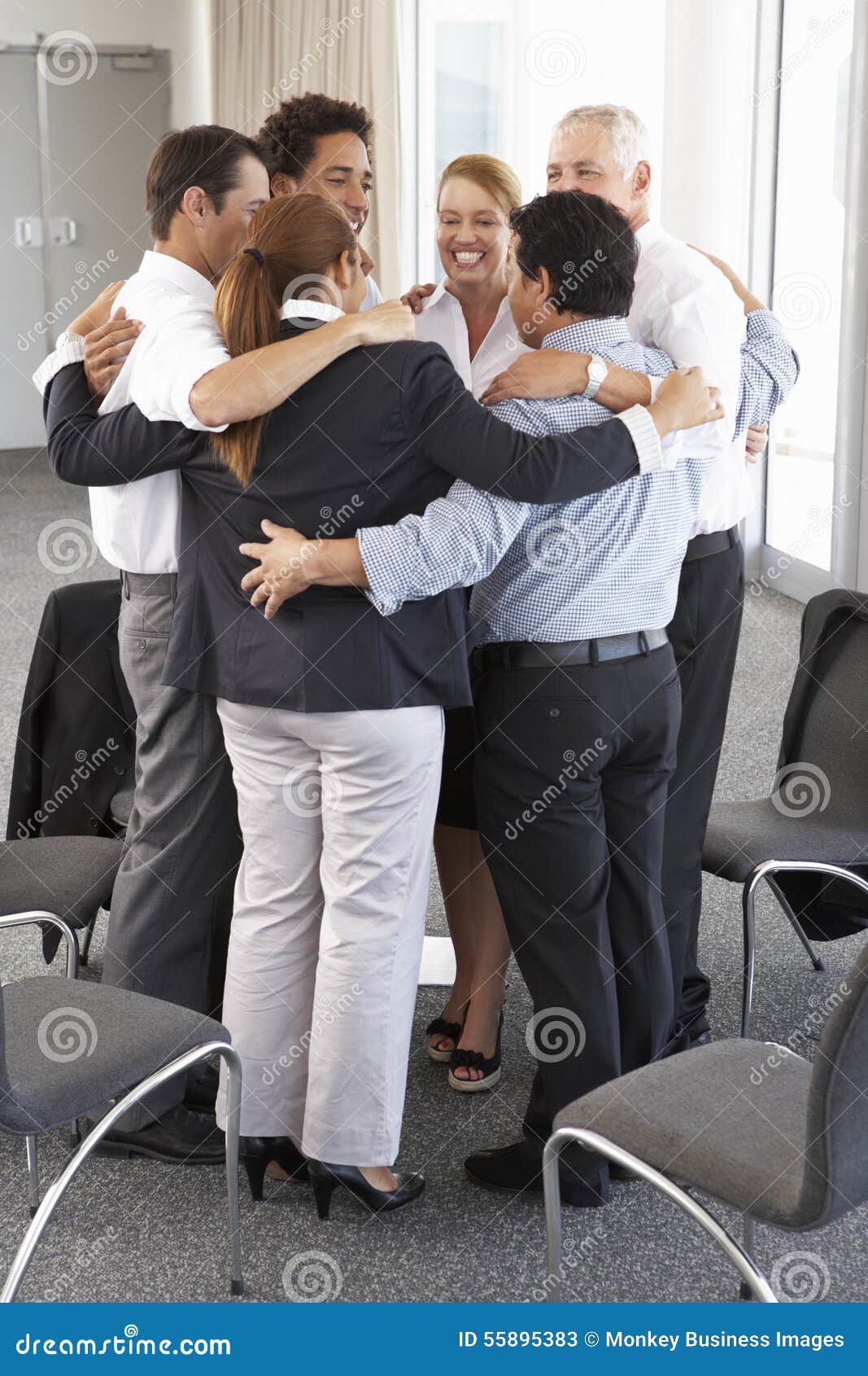 Group of Businesspeople Bonding in Circle at Company Seminar Stock ...
