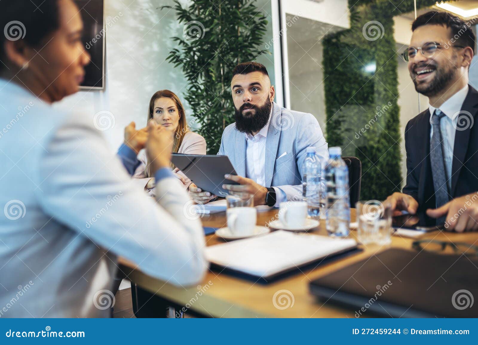 Businesspeople Having a Briefing in a Boardroom. Businesspeople Working ...