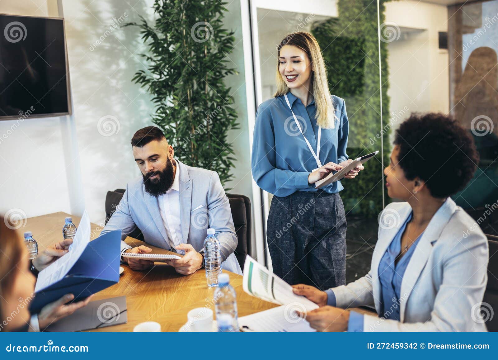 Businesspeople Having a Briefing in a Boardroom. Businesspeople Working ...