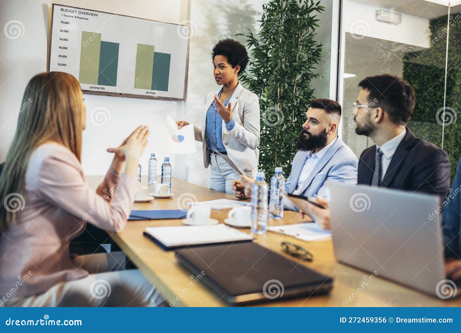 Businesspeople Having a Briefing in a Boardroom. Businesspeople Working ...