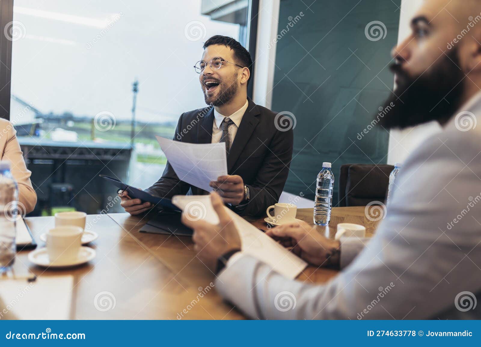 Group of Businesspeople Having a Briefing in a Boardroom Stock Photo ...