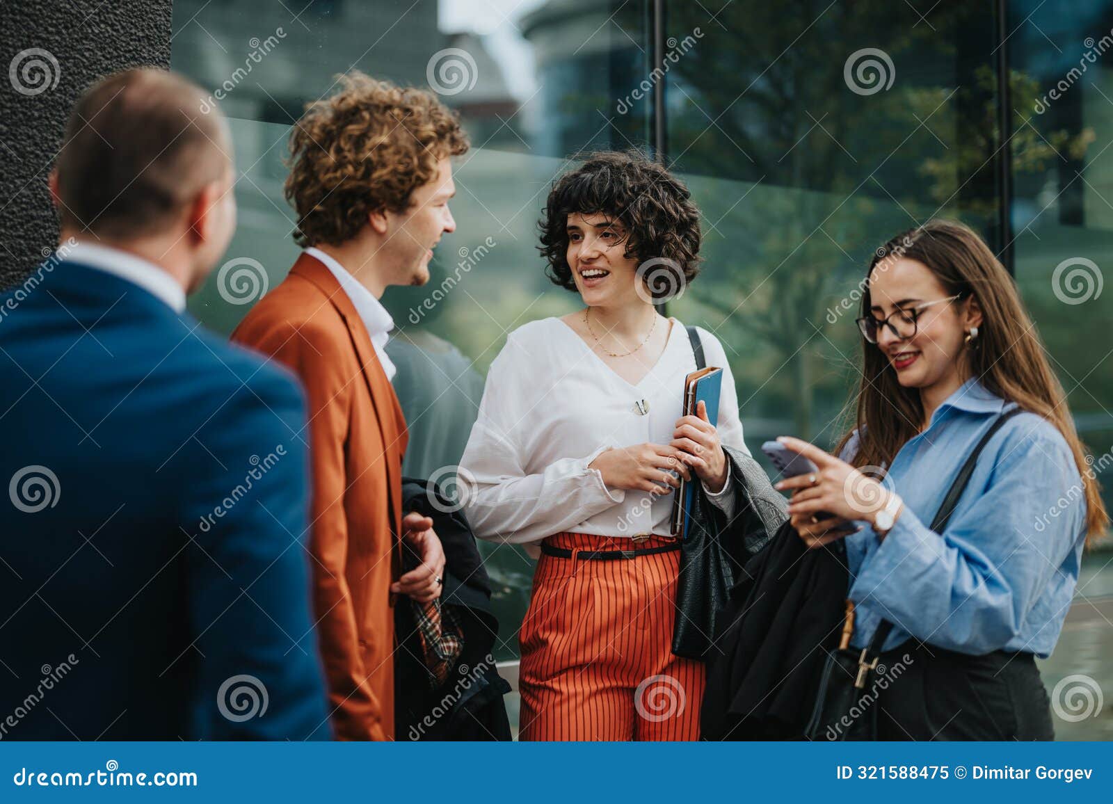 Outdoor Business Meeting with Diverse Professionals Discussing Projects ...