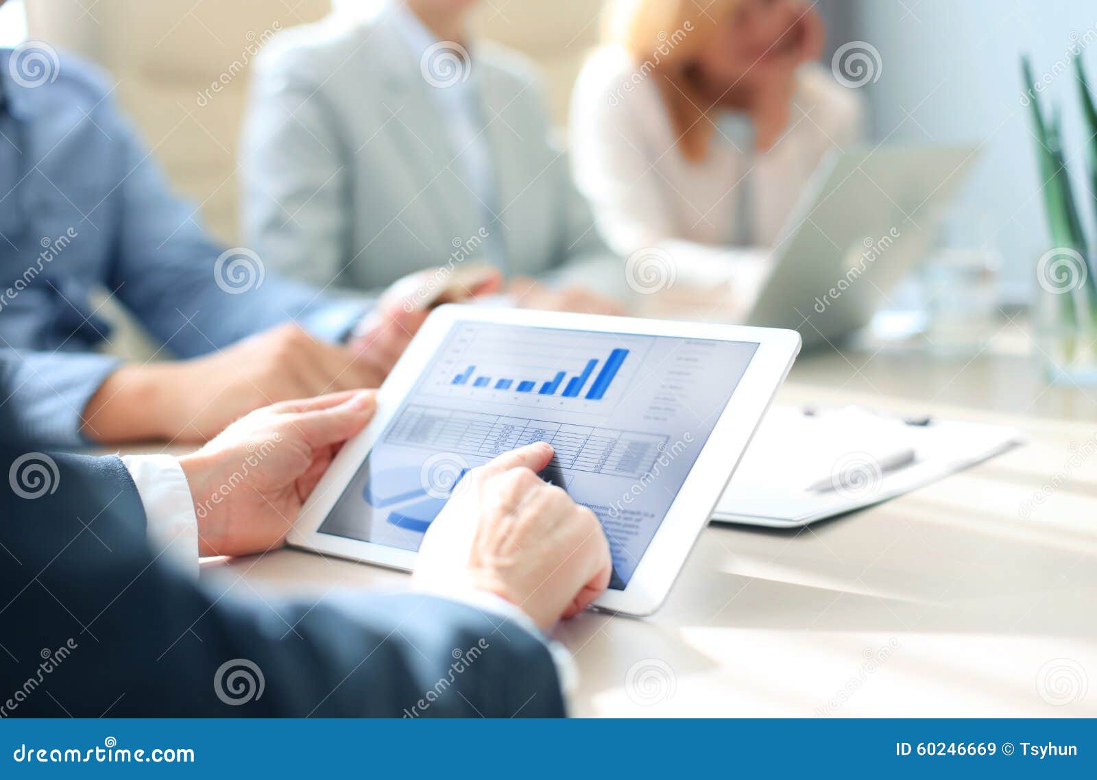 Group of Businesspeople Looking at Graphs Stock Image - Image of ...