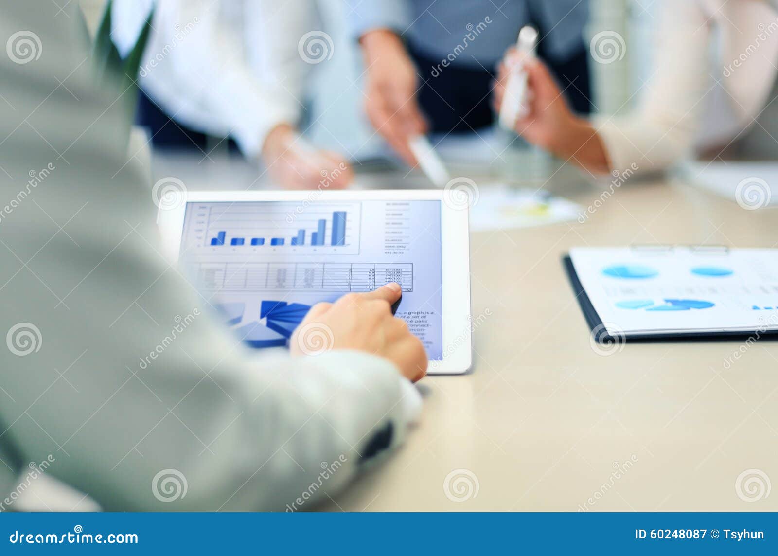 Group of Businesspeople Looking at Graphs Stock Image - Image of ...