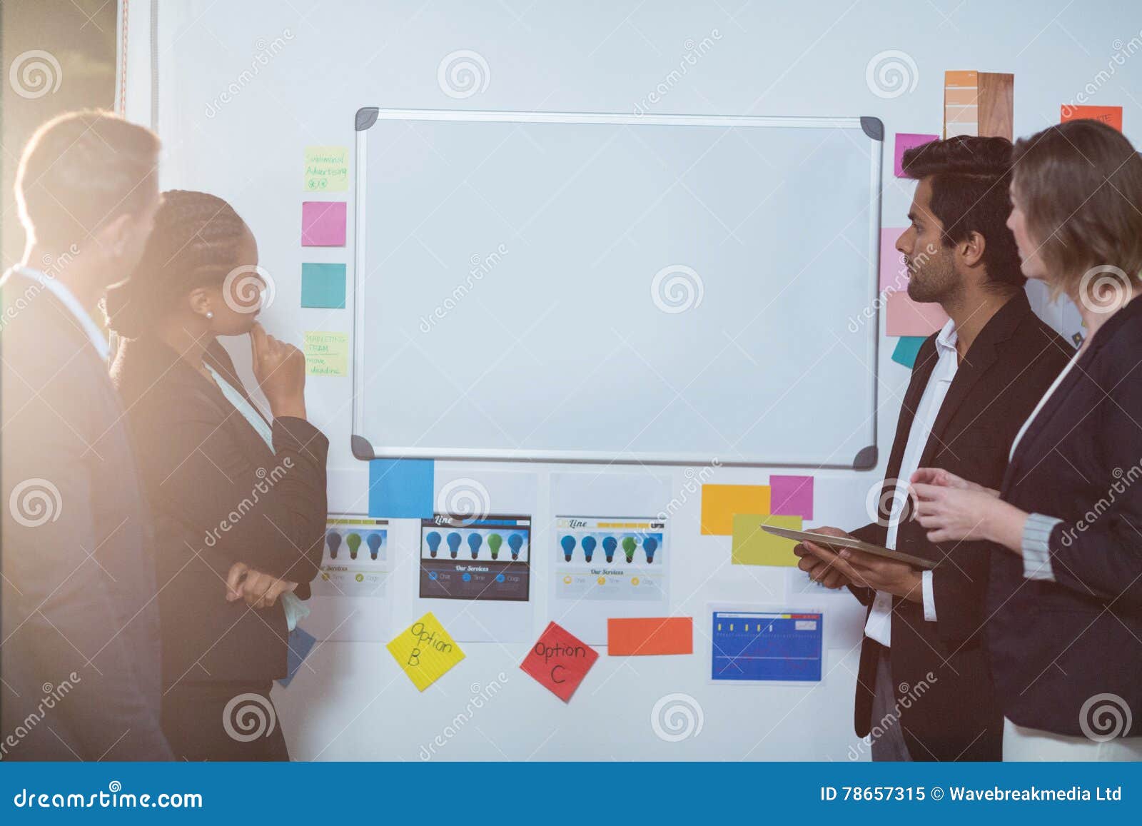 Group of Businesspeople Looking at Whiteboard Stock Image - Image of ...