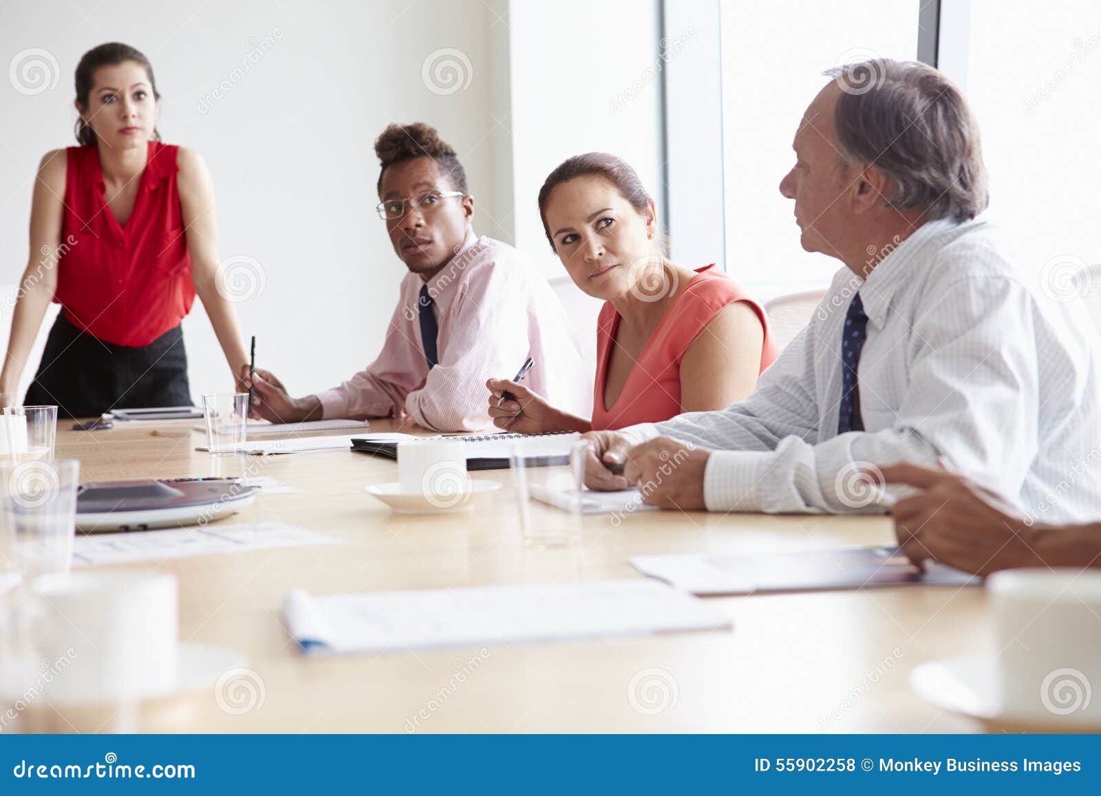 Group of Businesspeople Meeting Around Boardroom Table Stock Photo ...
