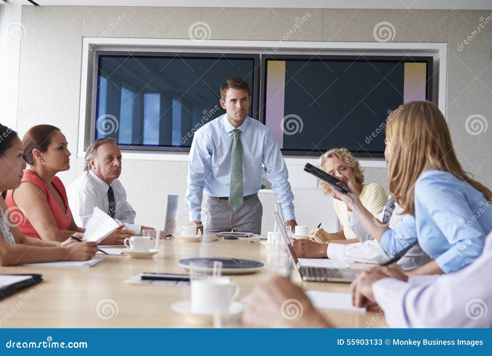 Group of Businesspeople Meeting Around Boardroom Table Stock Image ...