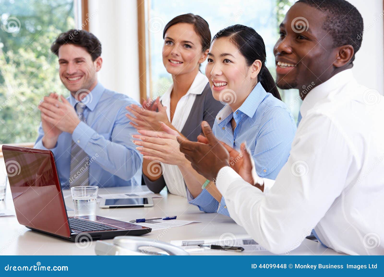 Group of Businesspeople Meeting Around Boardroom Table Stock Photo ...