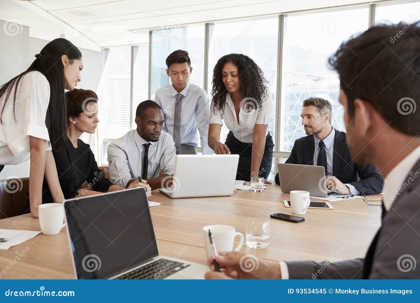 Group of Businesspeople Meeting Around Table in Office Stock Image ...