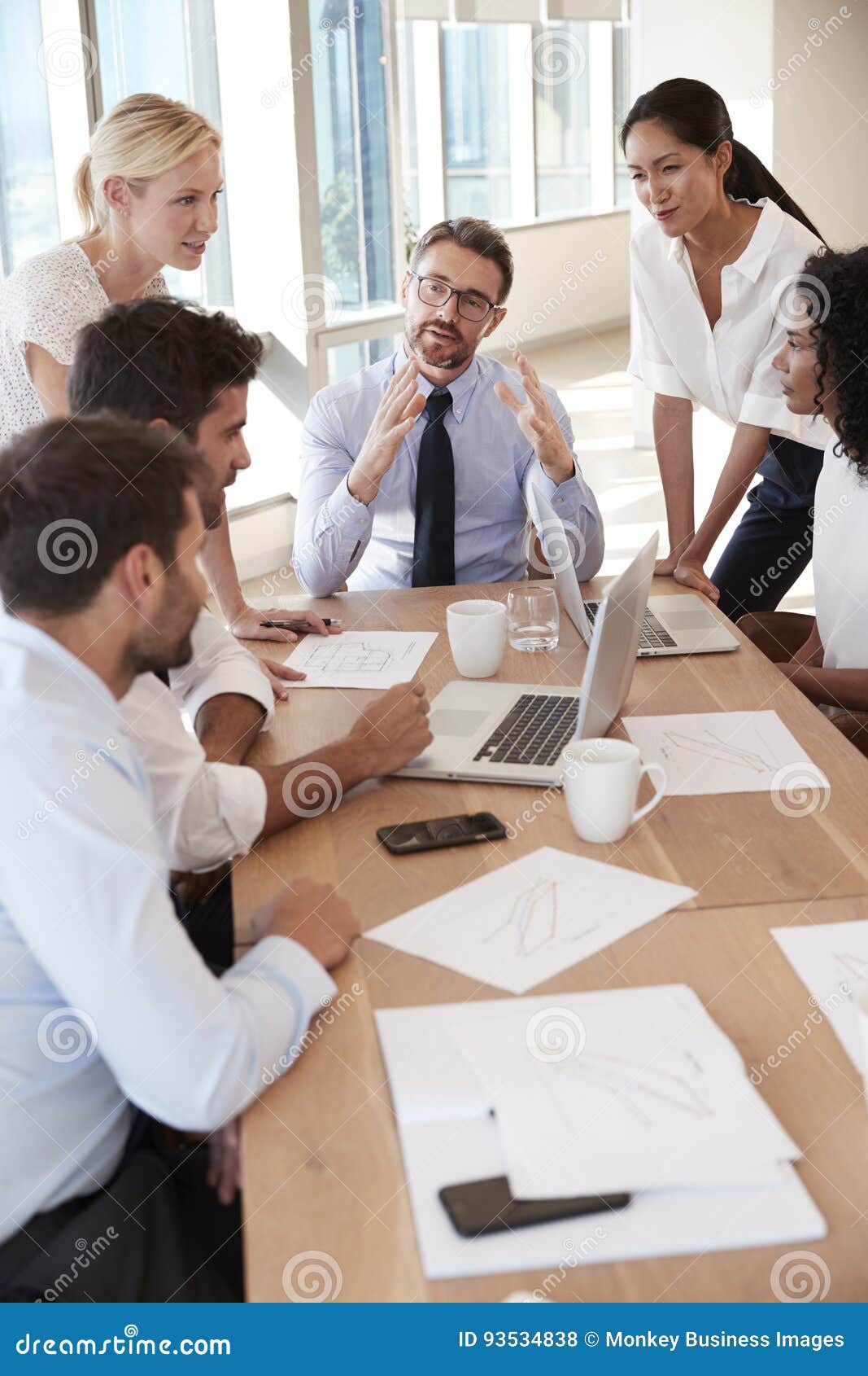 Group of Businesspeople Meeting Around Table in Office Stock Photo ...
