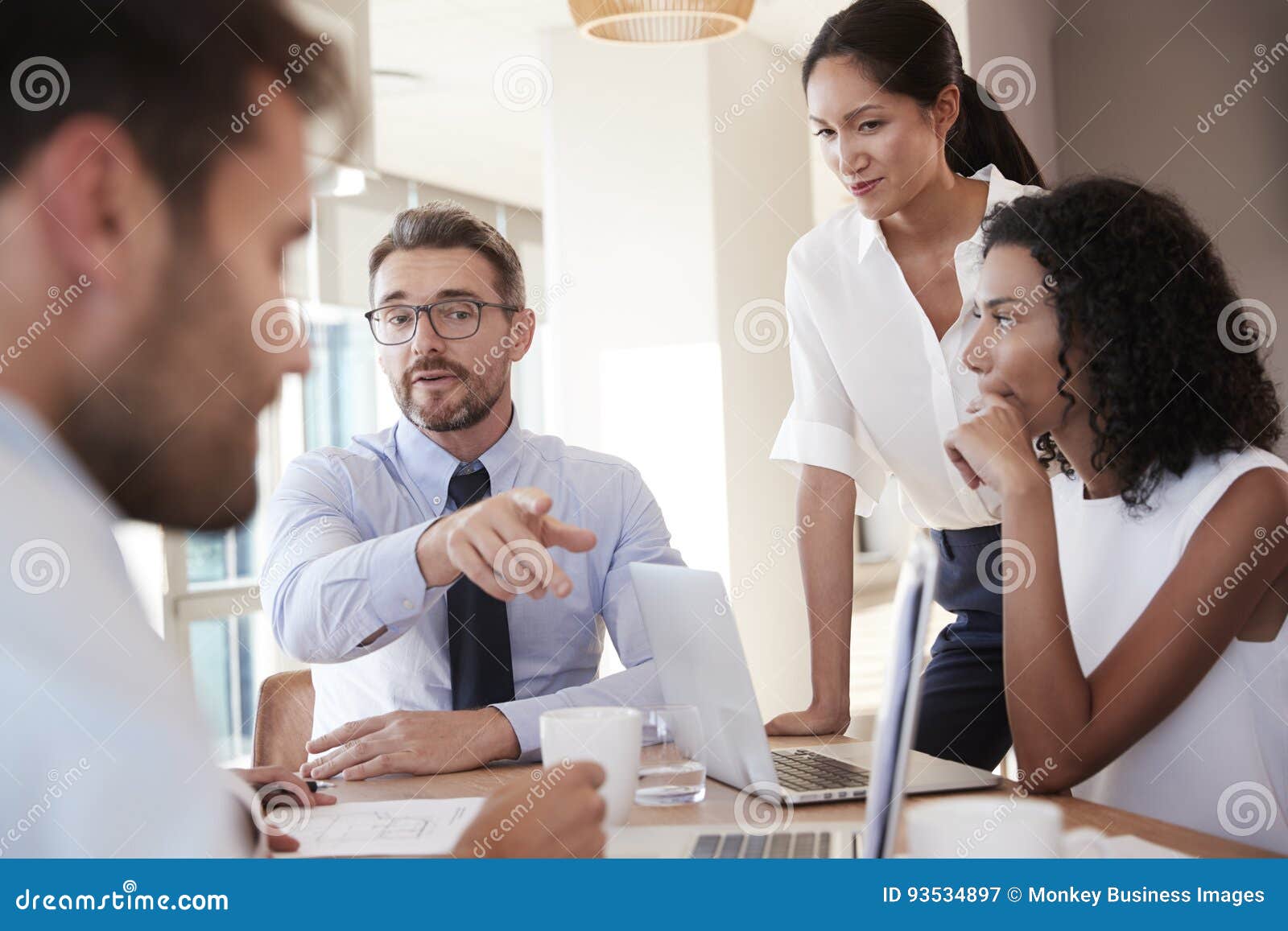 Group of Businesspeople Meeting Around Table in Office Stock Image ...