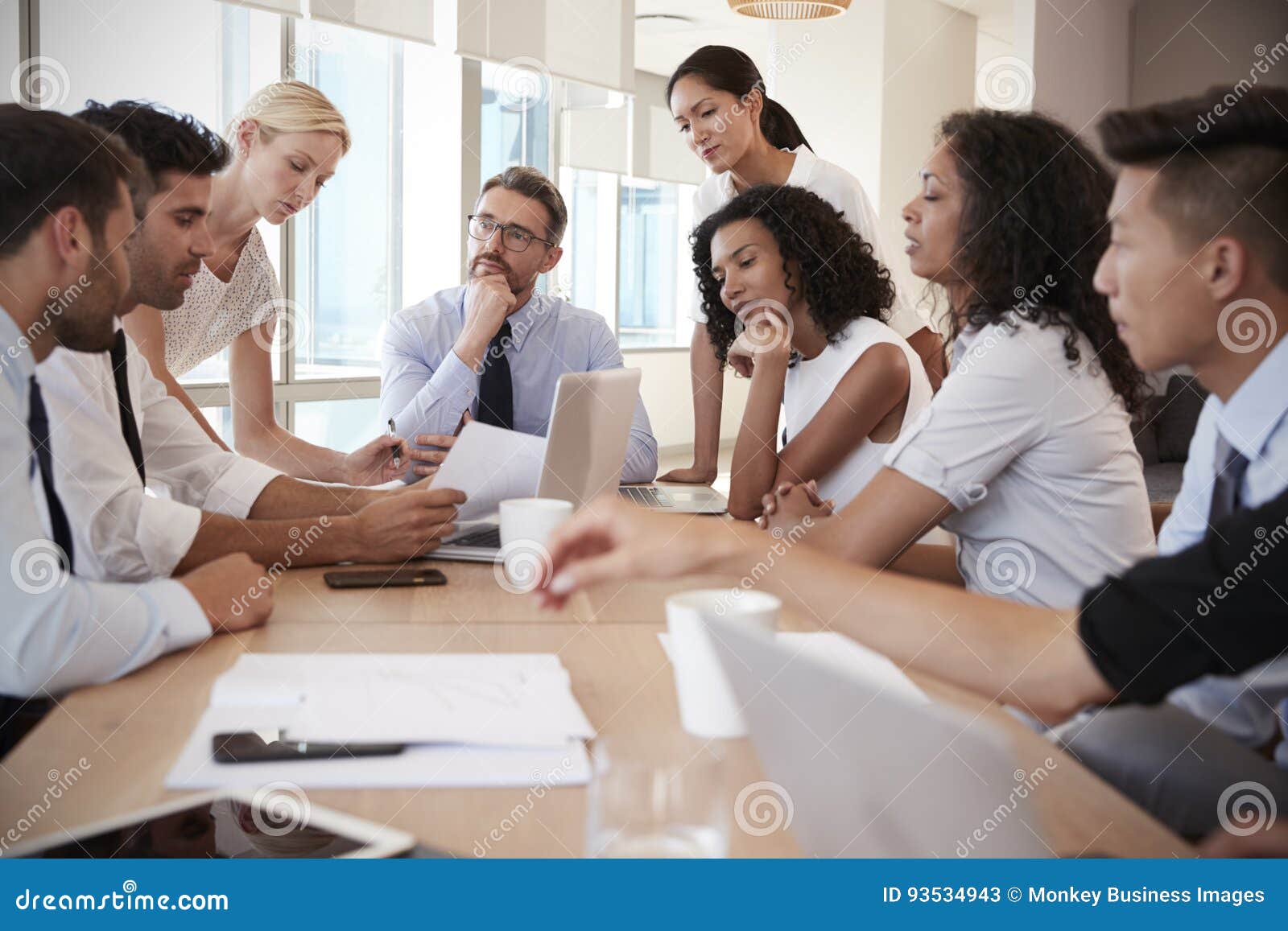 Group of Businesspeople Meeting Around Table in Office Stock Image ...