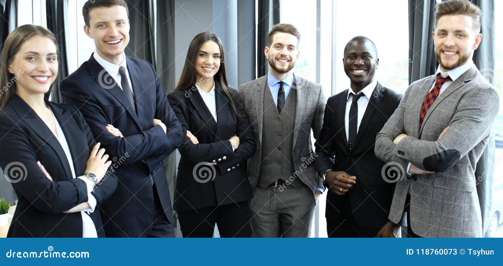 Group Of Businesspeople Standing Together In Office Stock Image