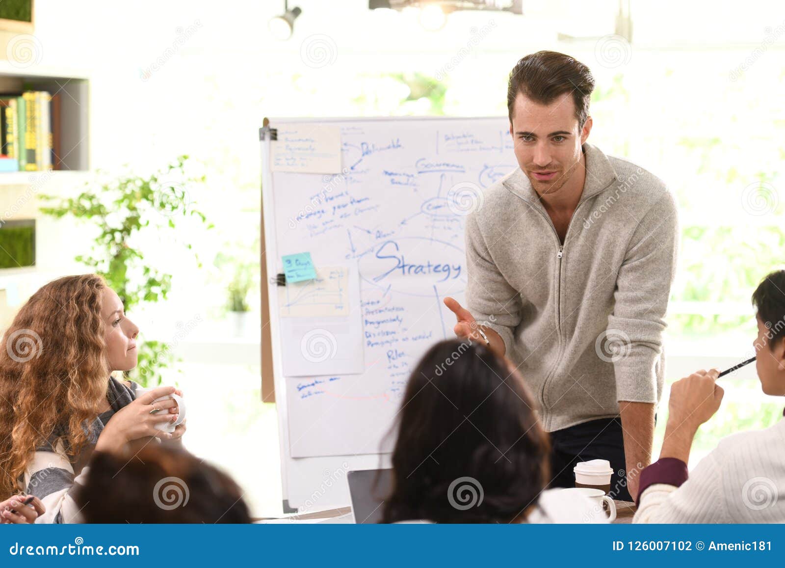 Group of Business Persons in Creative Business Discussing Work in the ...