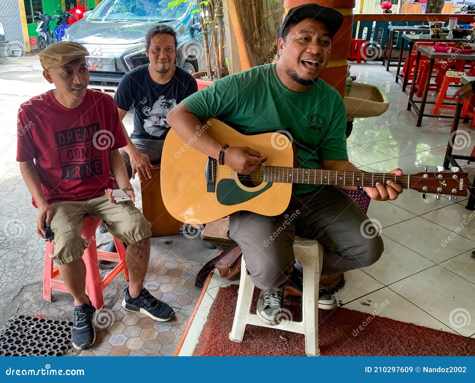 A Group of Buskers in Action at a Corner of a Soto Stall in Semarang ...