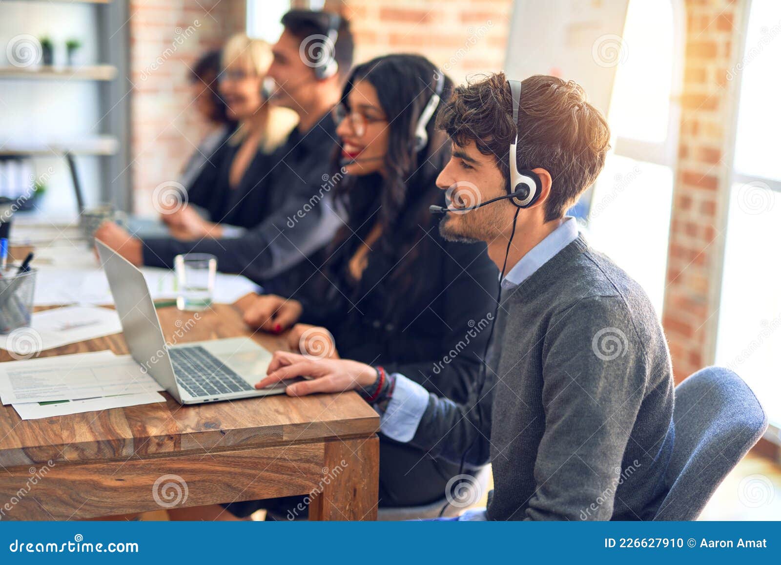 Group of Call Center Workers Smiling Happy and Confident Stock Photo ...
