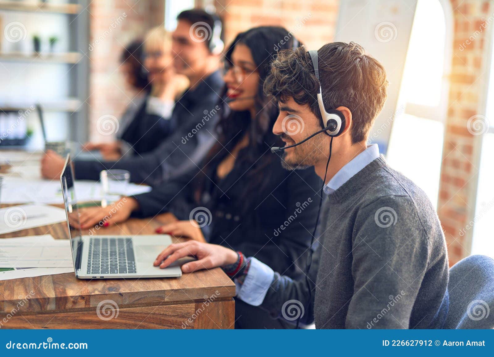 Group of Call Center Workers Smiling Happy and Confident Stock Photo ...