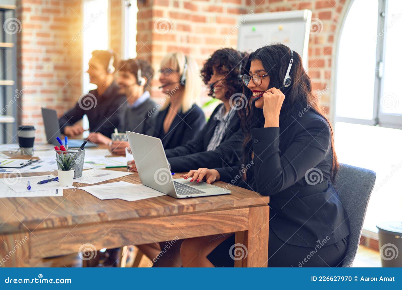 Group of Call Center Workers Smiling Happy and Confident Stock Photo ...
