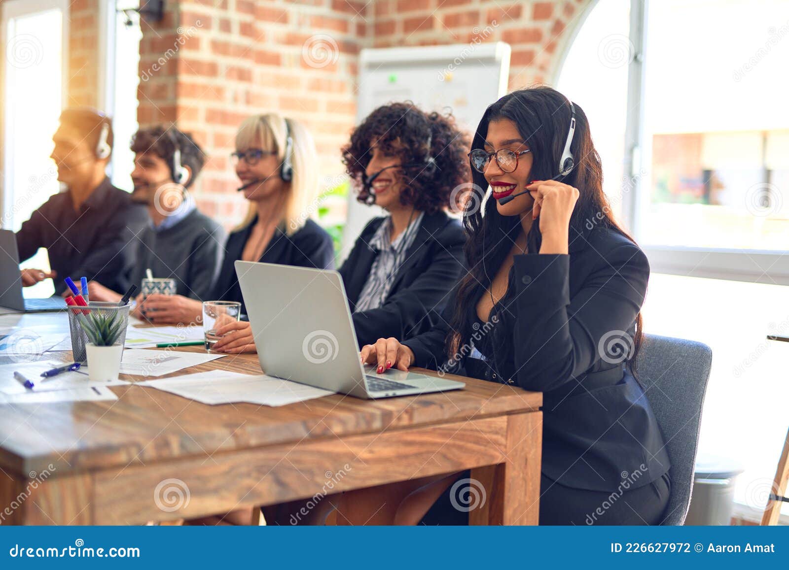 Group of Call Center Workers Smiling Happy and Confident Stock Photo ...