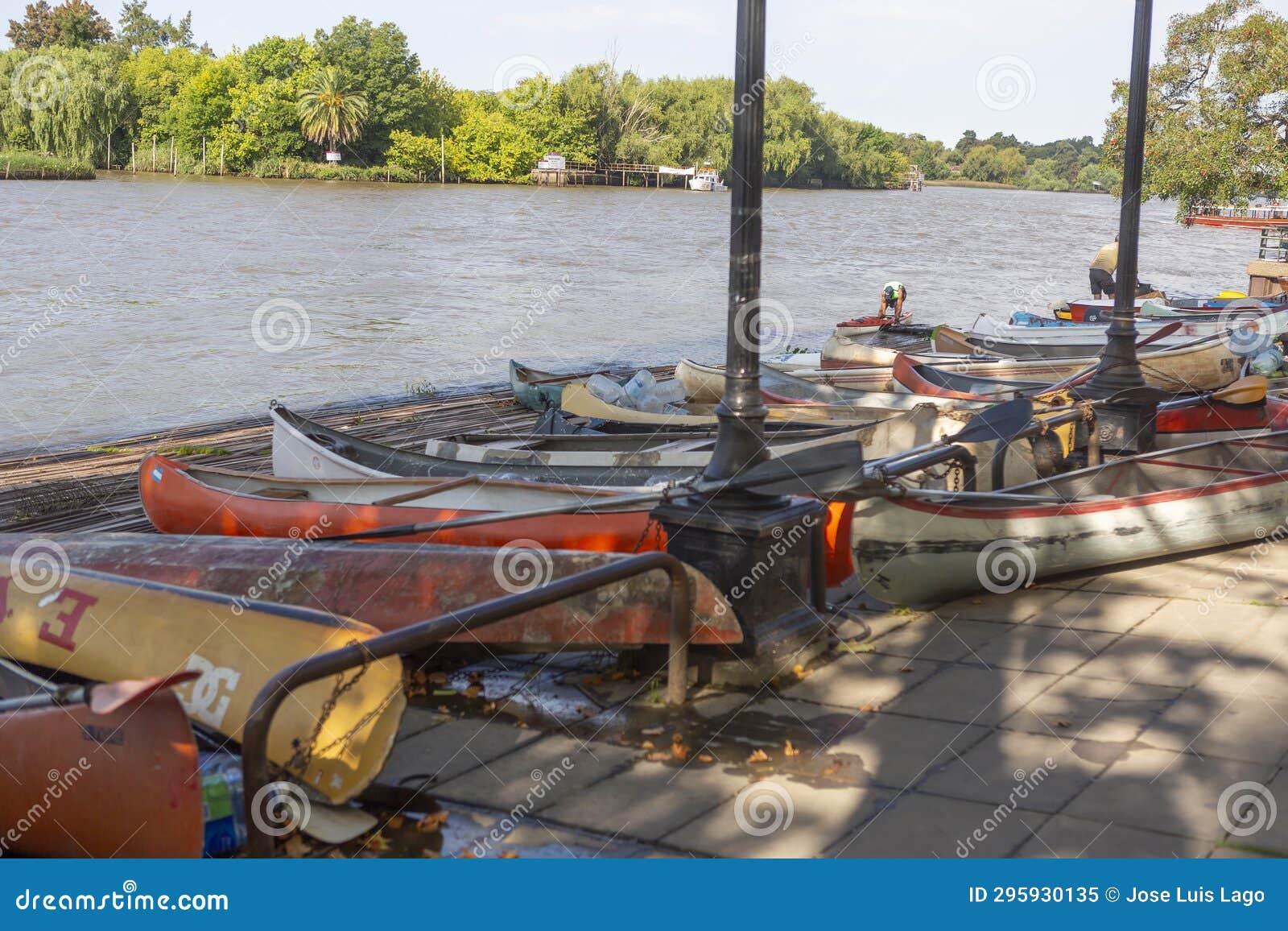 Group of Canoes Piled Up on the Edge of the River Stock Image - Image of multi, canoe: 295930135
