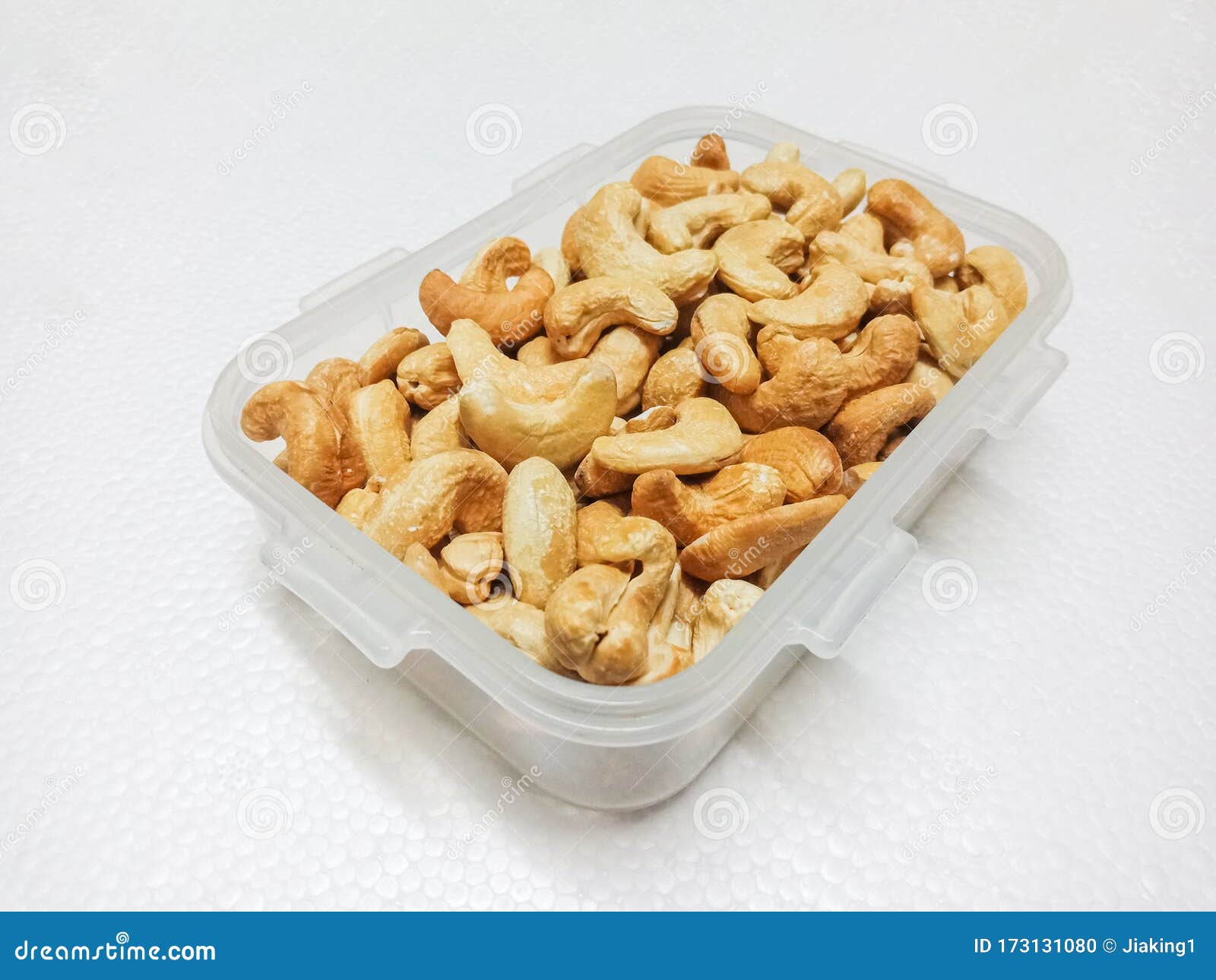 Group of Cashews in Plastic Box on White Stock Photo - Image of roasted ...