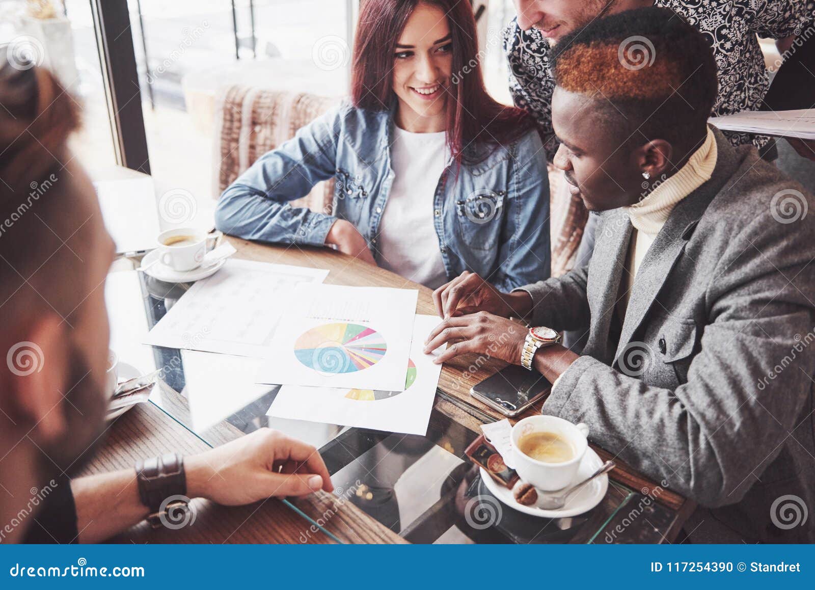 Group of Casually Dressed Businesspeople Discussing Ideas. Creative ...