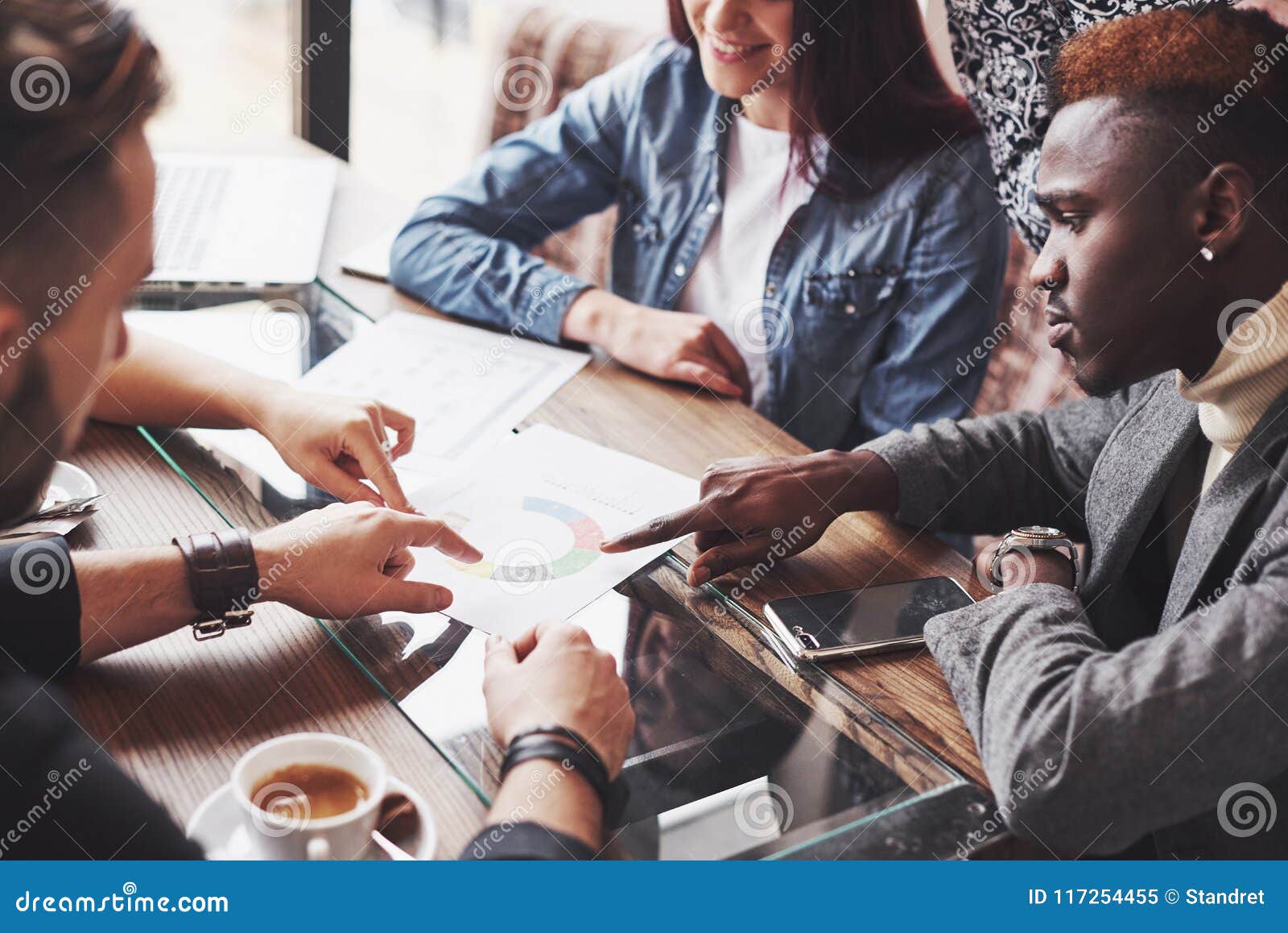 Group of Casually Dressed Businesspeople Discussing Ideas. Creative ...