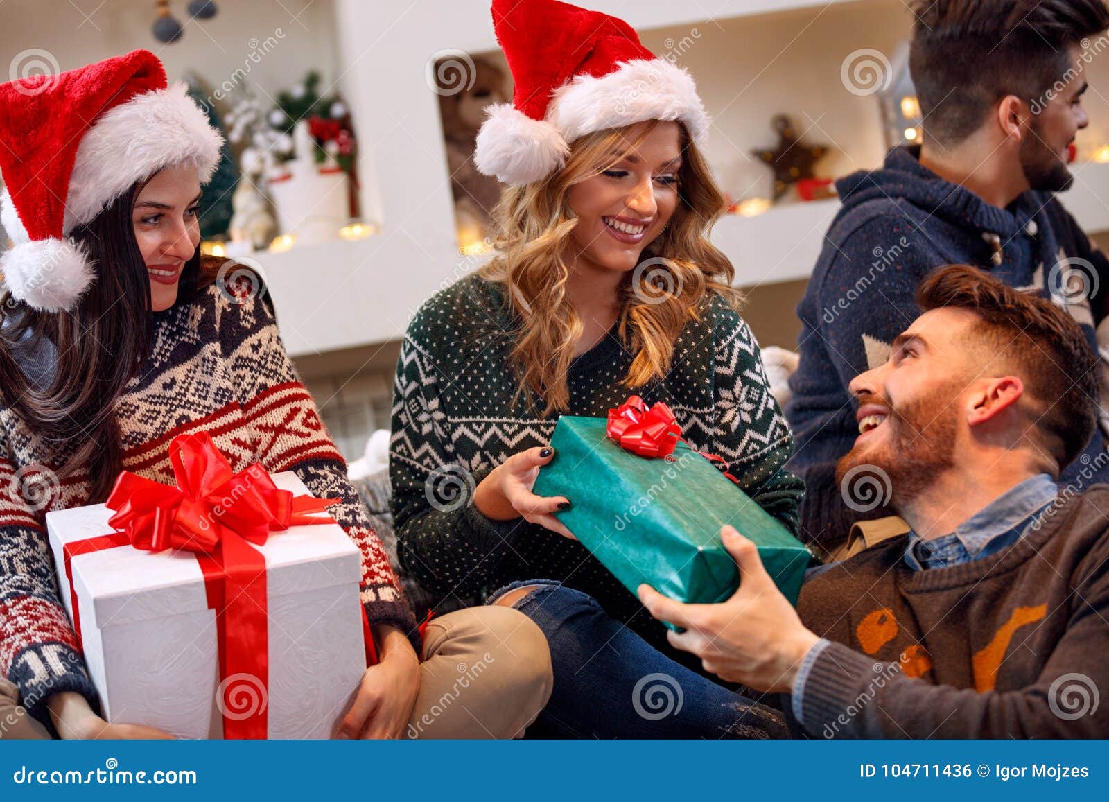 Group of Friends Exchanging Gift Boxes at Christmas Eve Stock Photo ...