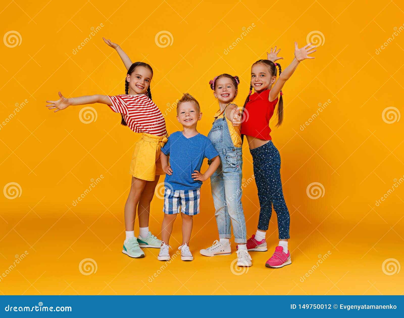 Group of Cheerful Happy Children on Colored Yellow Background Stock ...
