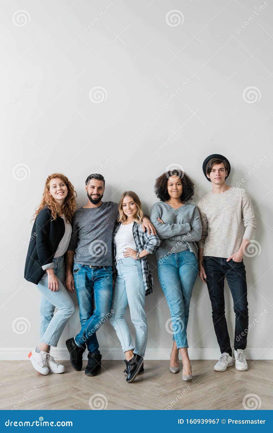 Group of Cheerful Young Affectionate Friends in Jeans and Pullovers ...