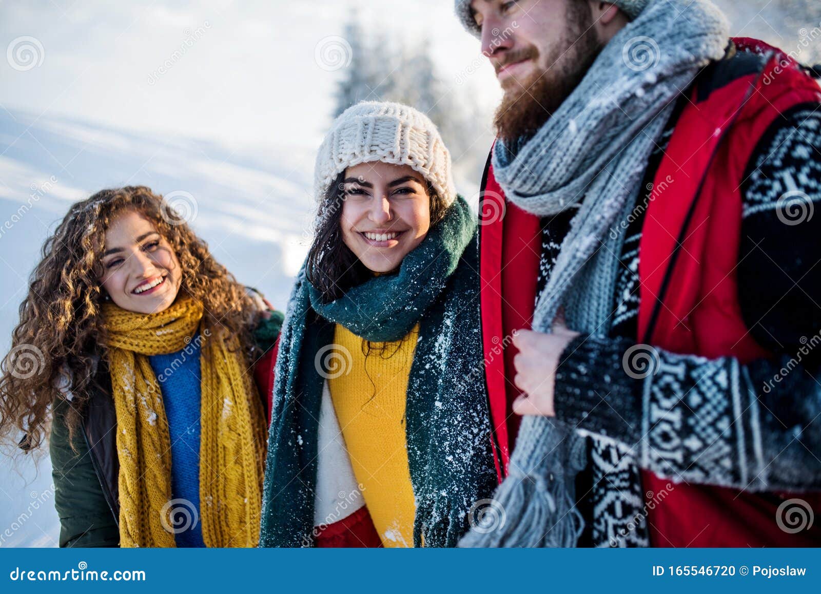 Group of Cheerful Young Friends Outdoors in Snow in Winter Forest ...
