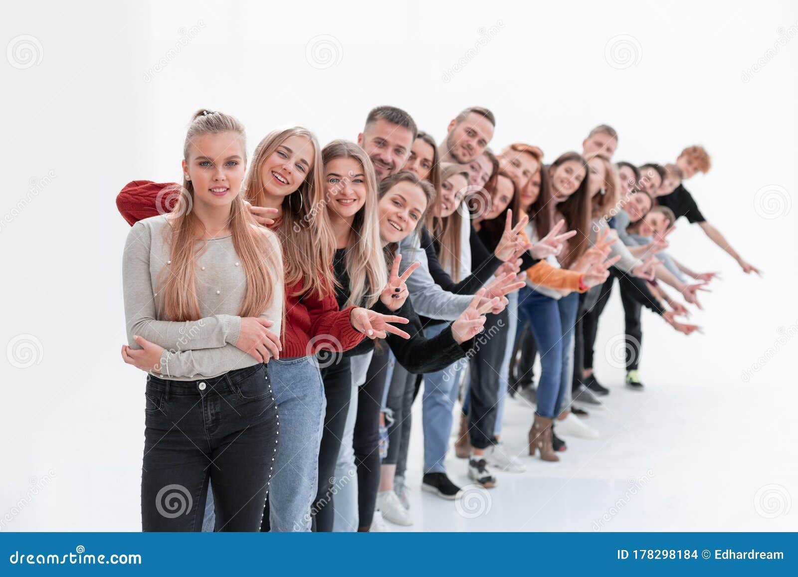 Group of Cheerful Young People Standing Behind Each Other Stock Photo ...