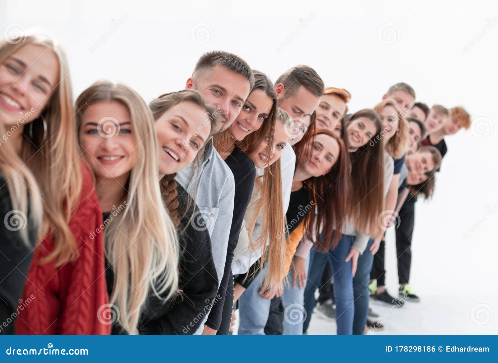 Group of Cheerful Young People Standing Behind Each Other Stock Photo ...