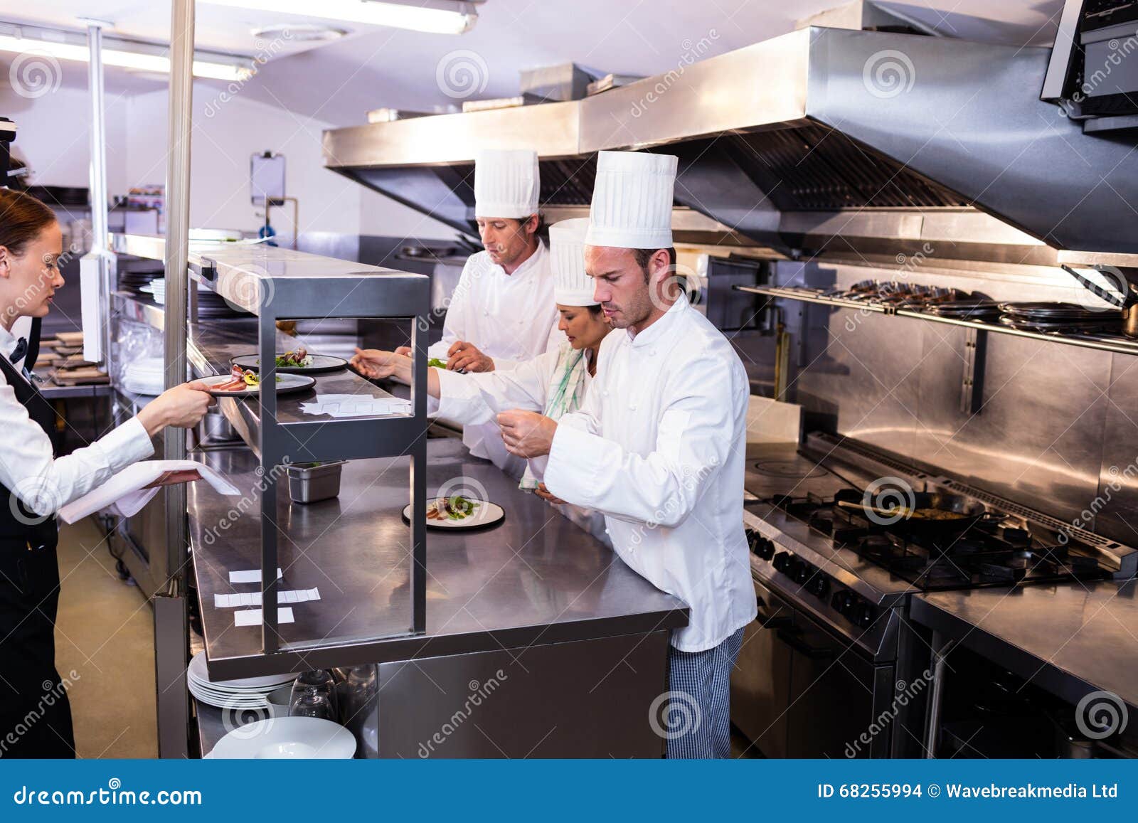 Group of Chef Preparing Food in Commercial Kitchen Stock Photo - Image ...