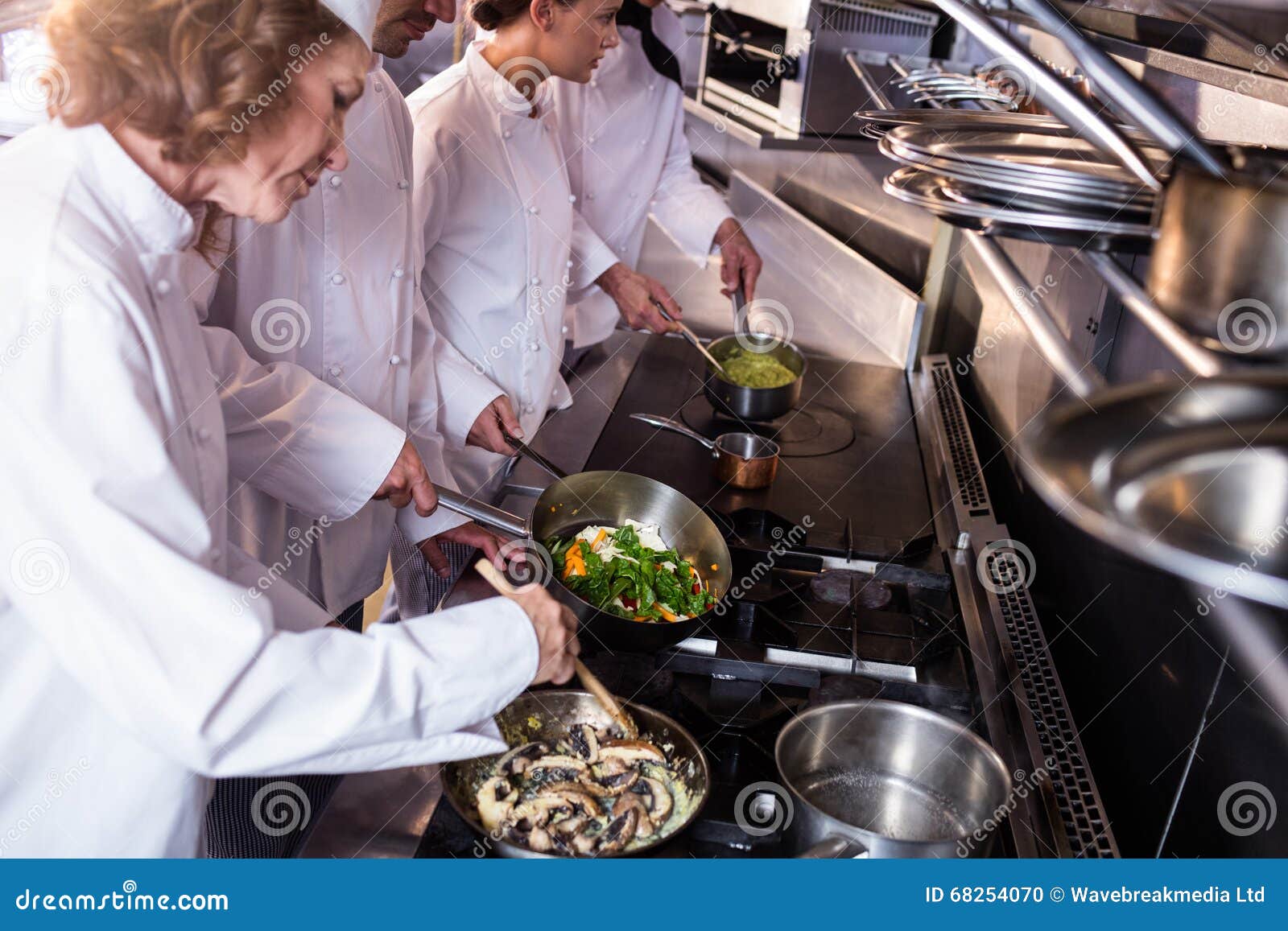Group of Chef Preparing Food in the Kitchen Stock Photo - Image of ...