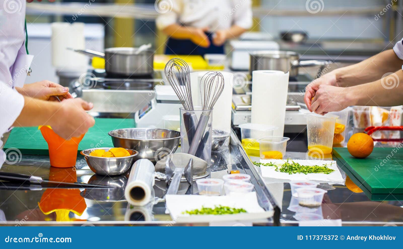 Group of Chef Preparing Food in the Kitchen of a Restaurant Stock Photo ...