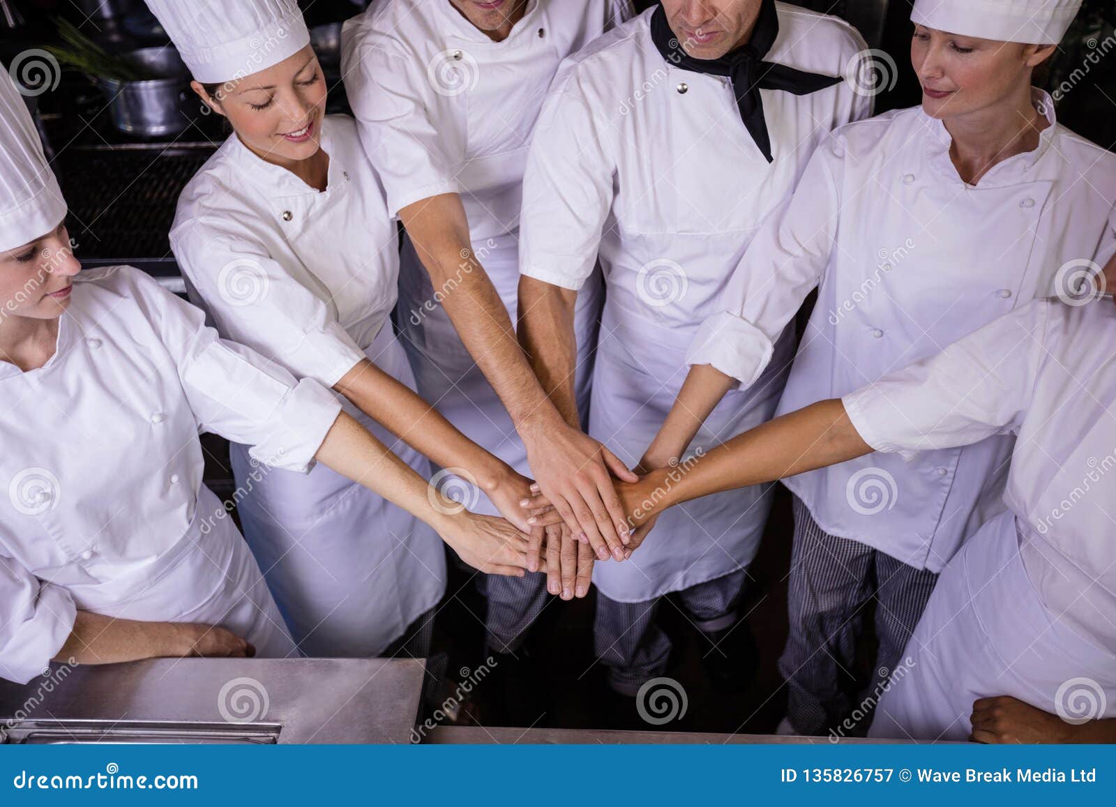 Group Of Chefs Formig Hands Stack In Kitchen Royalty-Free Stock ...