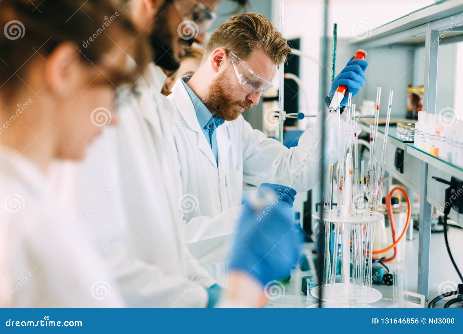 Group of Chemistry Students Working in Laboratory Stock Photo - Image ...