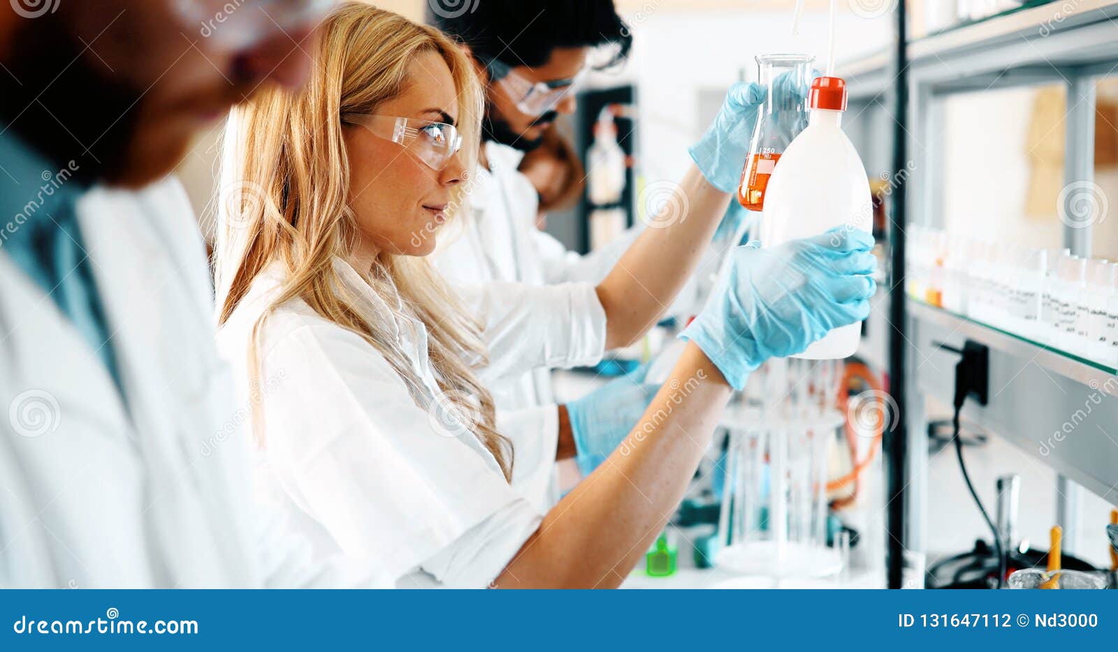 Group of Chemistry Students Working in Laboratory Stock Photo - Image ...