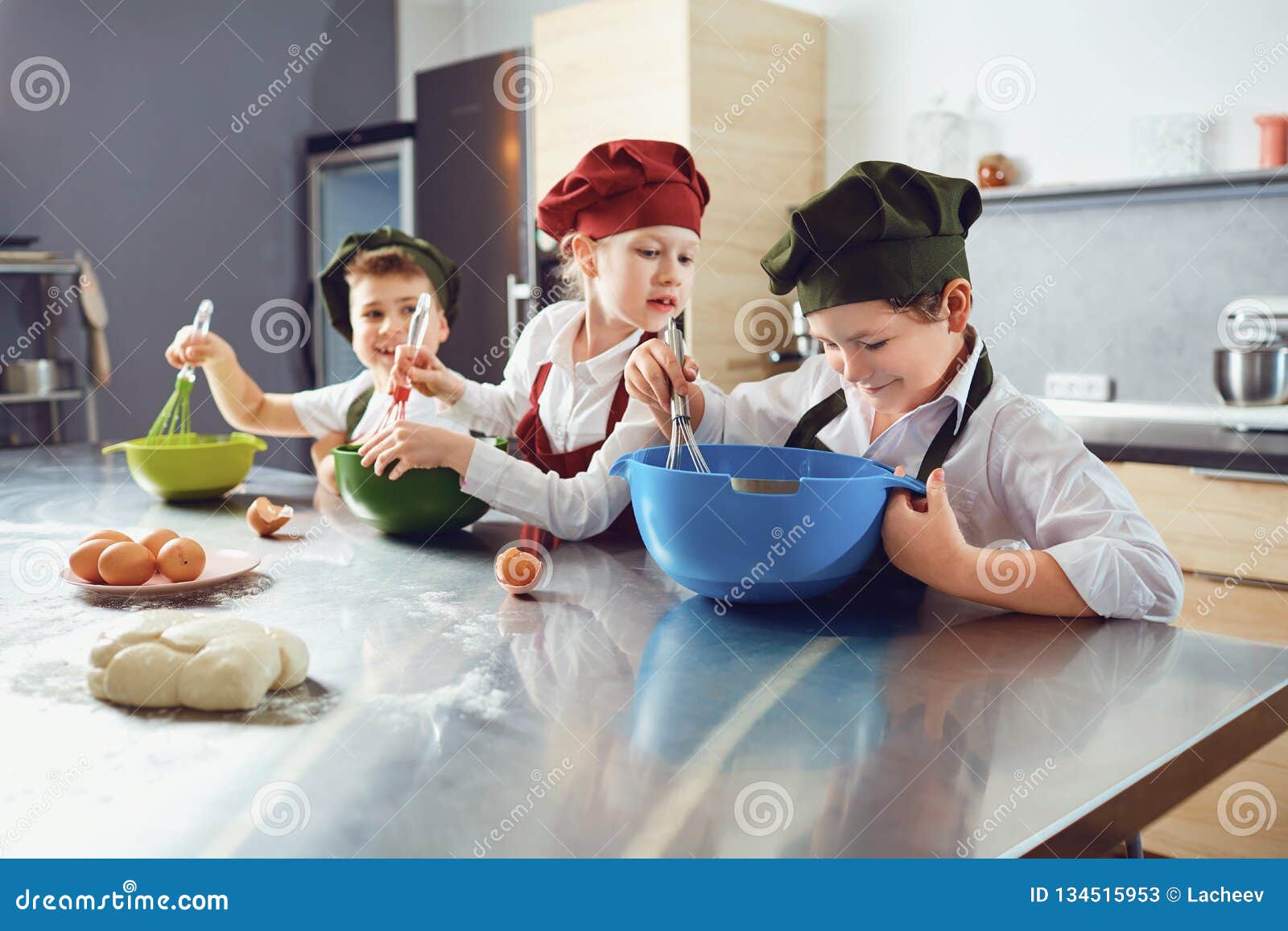 A Group of Children are Cooking at the Table in the Kitchen Stock Image ...