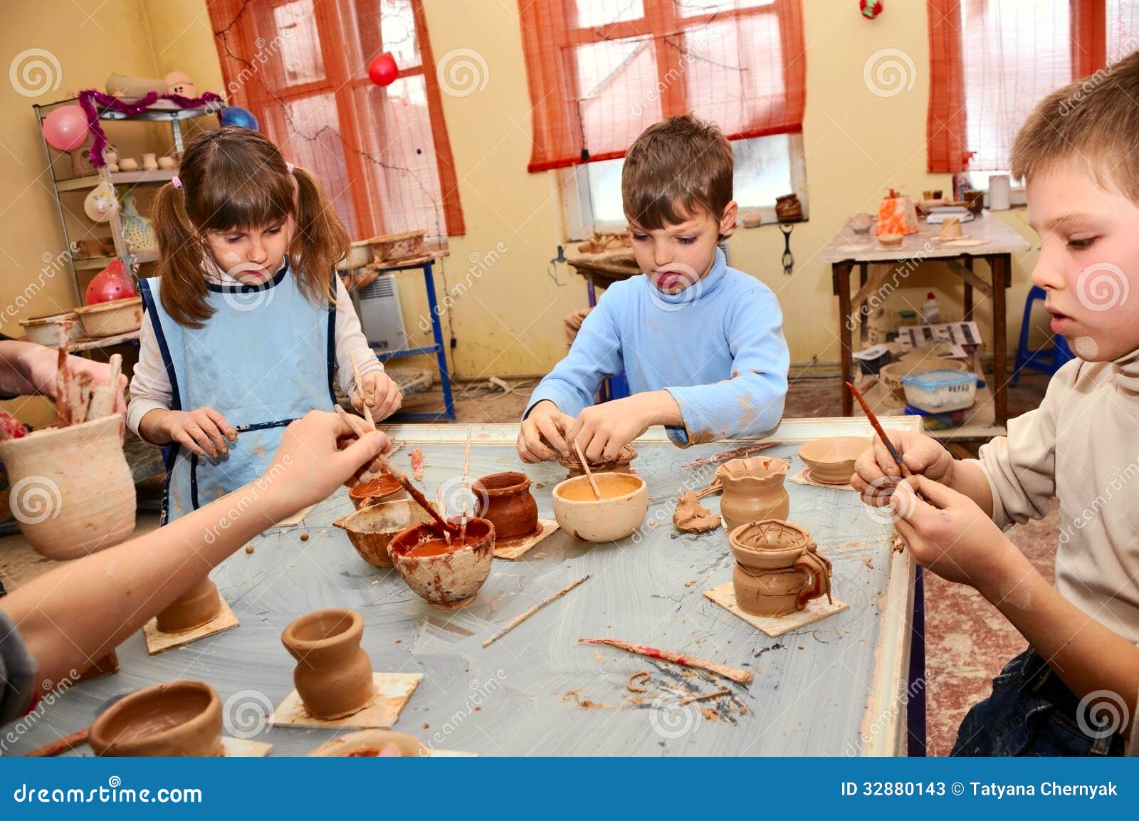 Group of Children Decorating Their Clay Pottery Stock Image - Image of ...