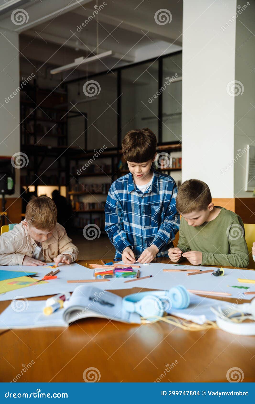 Group of Children Drawing during Art Lesson in Library Stock Photo ...