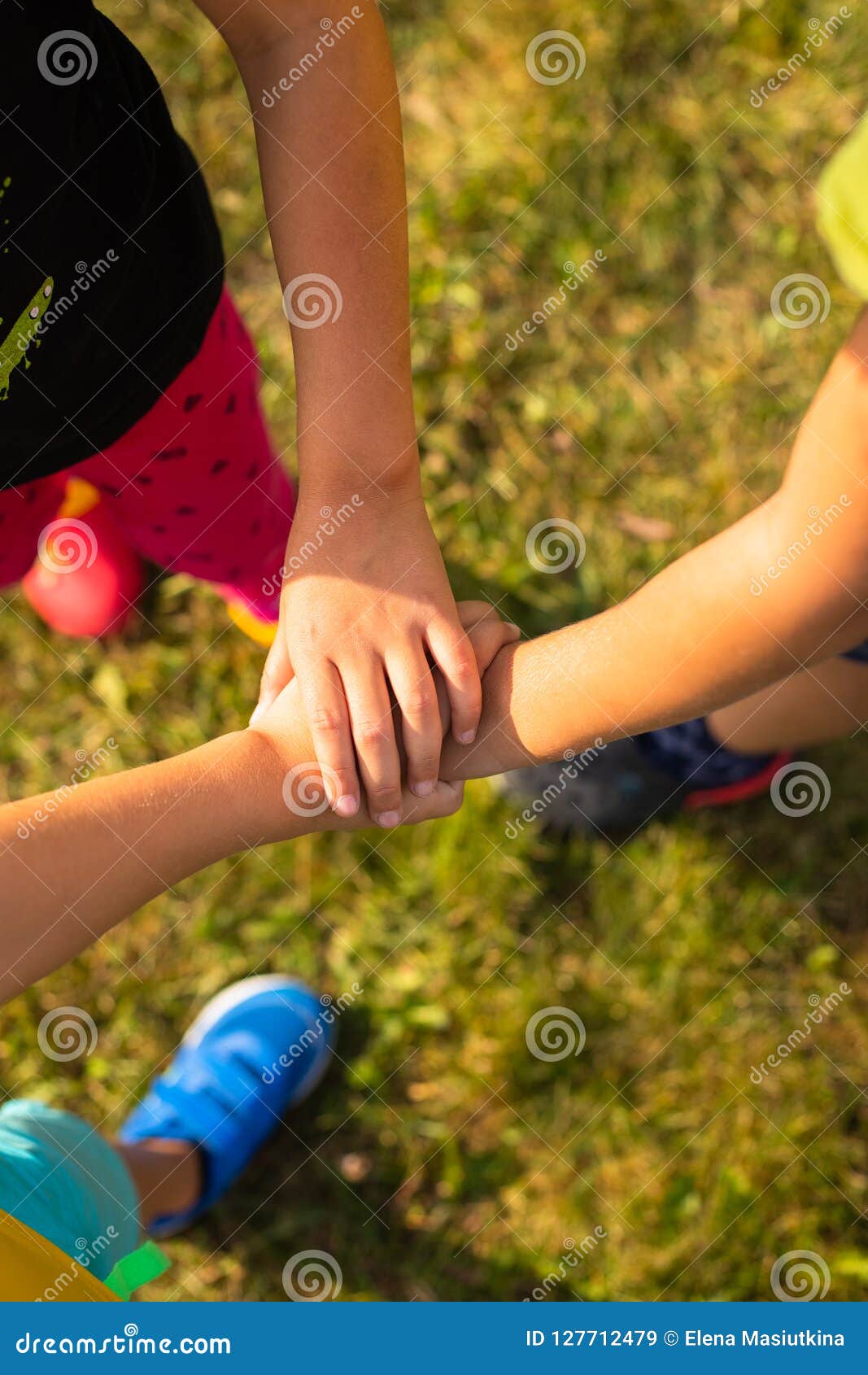 Group of Children Hands Join Together in Collaborative Game. Stock ...