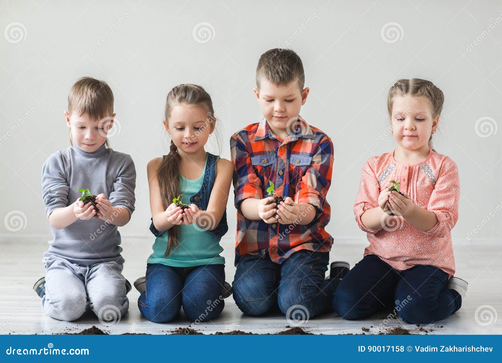 Group of Children Holding a Handful of Soil with the Plant Stock Photo ...